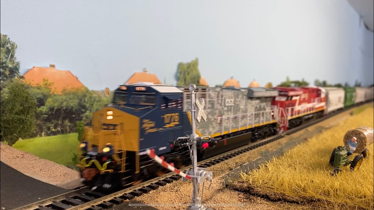 HO Scale CSX 1776 leads grain train with CSX 911 on model railroad ...