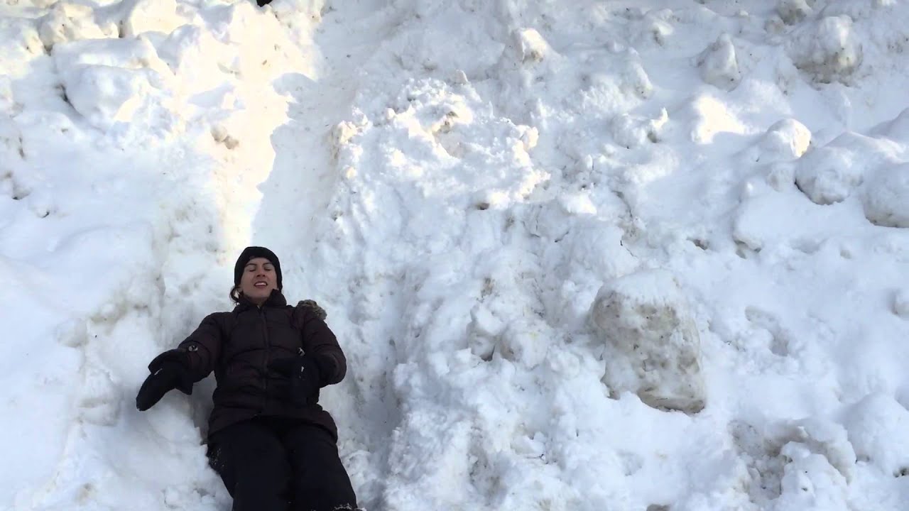 Sliding down the snow bank - YouTube