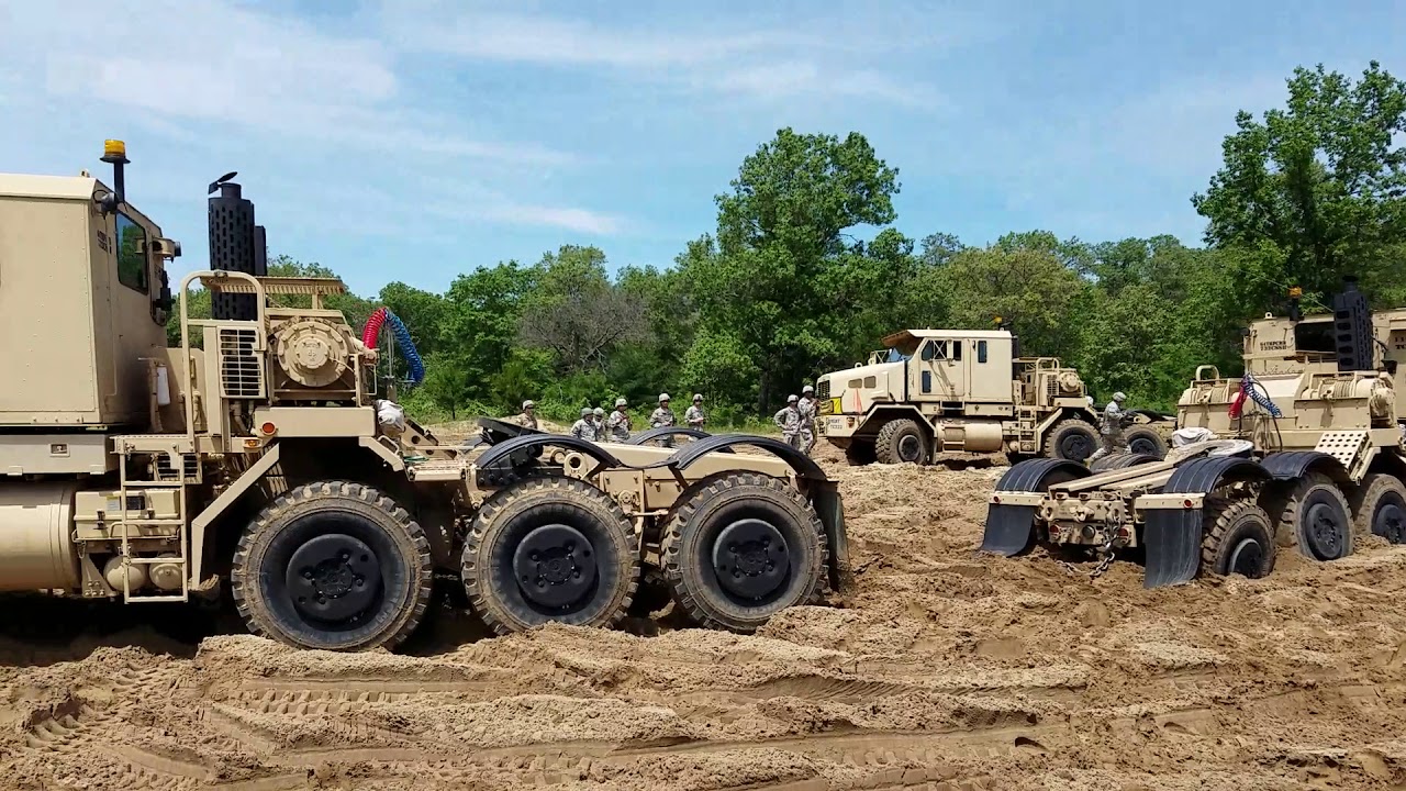 M1070 stuck in the sand - YouTube