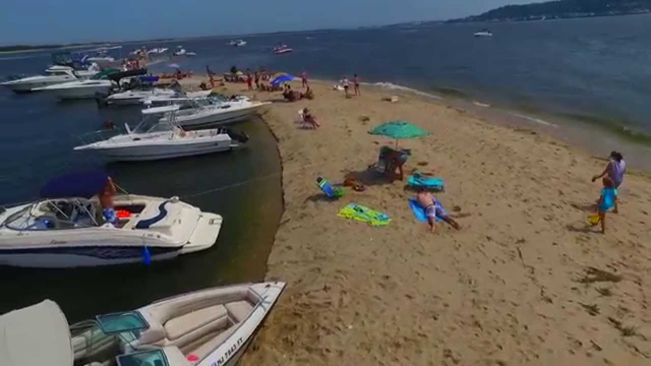 Aerial view boat/beach day - YouTube