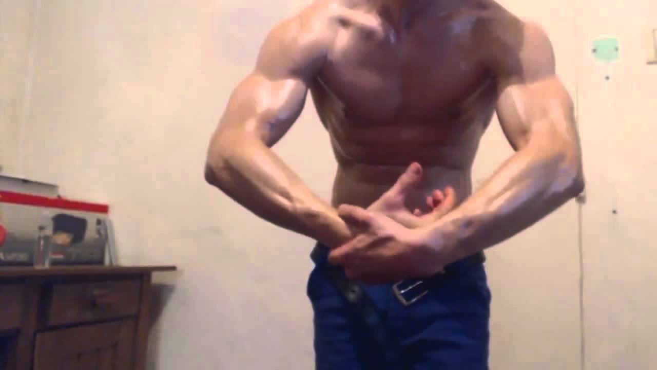 flexing oiled body muscles show (old video) - YouTube