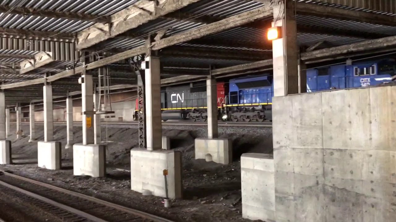 CN SD75I leads an all EMD lashup manifest through the McCormick Place - YouTube