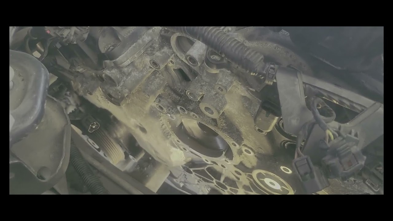 2010 Chevy Traverse timing chain fix part 3, the cover is off - YouTube