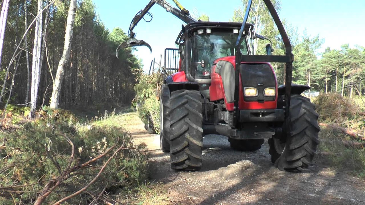 Valtra tractors with forestry crane and a boggikärra after loading ...