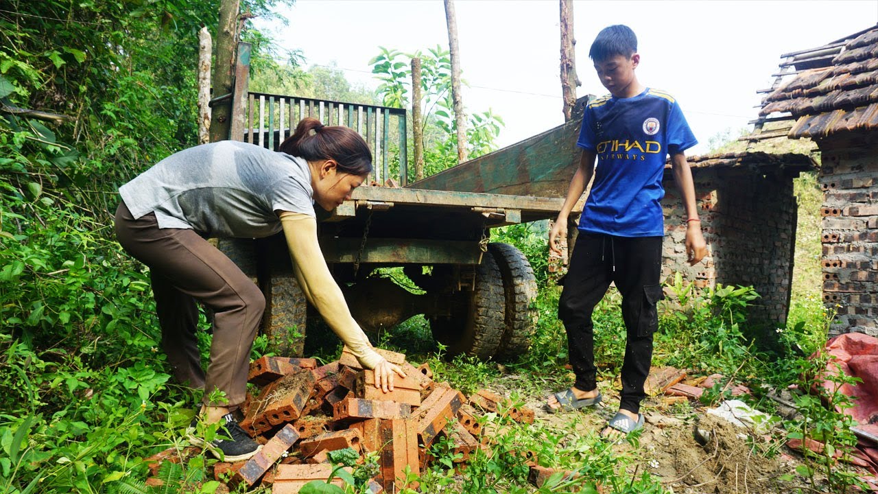 Poor boy cleaning house - Picking up bricks and shoveling sand from the ...