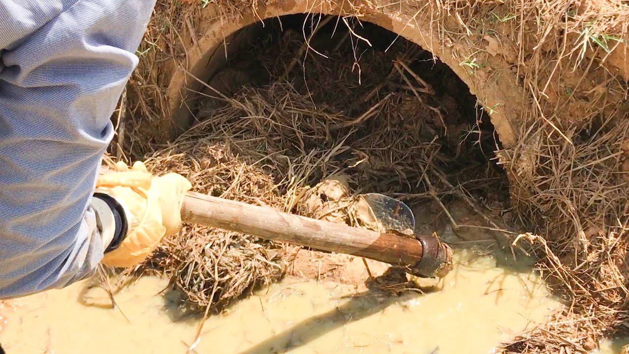 Unclogging Culvert Next To Street Removing Culvert Clogs - YouTube