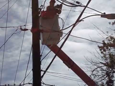 Hydro man removes old burnt transformer that blew up - YouTube