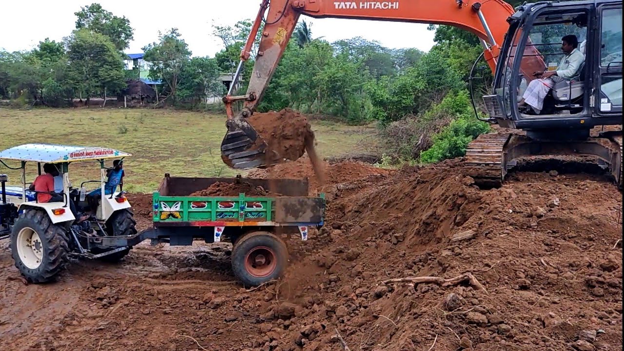 tata hitachi zaxis 140 loading tractor to hitachi - YouTube
