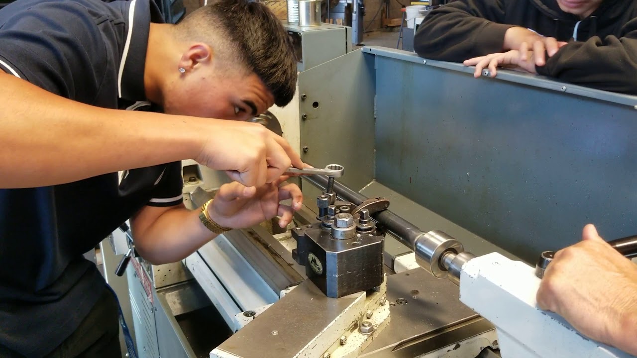 Valley High school students knurling pipe - YouTube