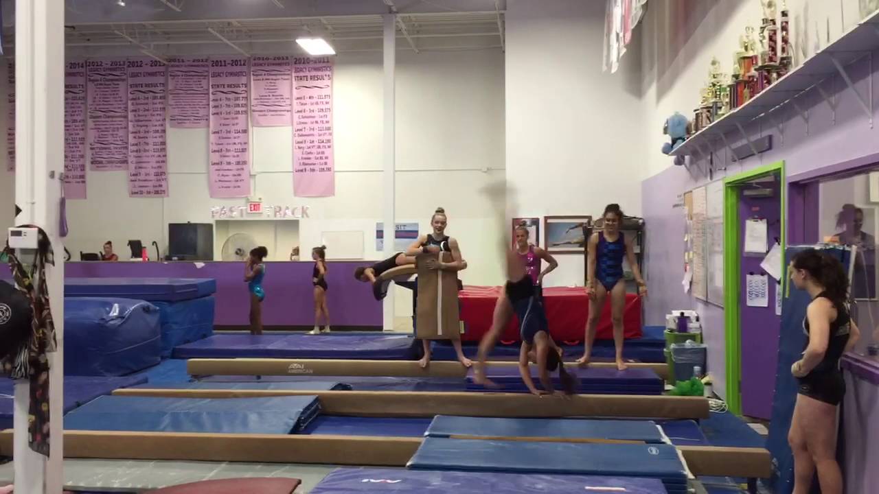 Backhand spring backhand spring back layout step out - YouTube