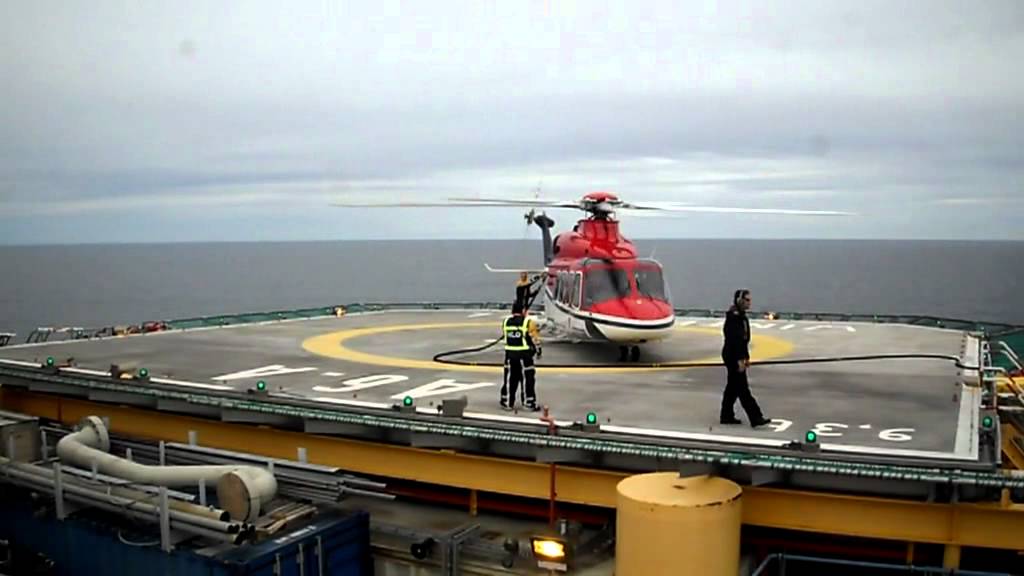 Helicopter landing, refuelling and take off at production platform A6-A ...