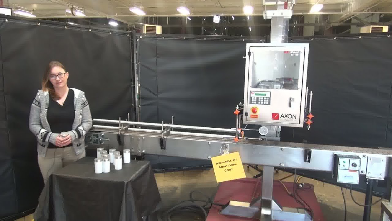 Axon Automatic Tamper Evident Shrink Neck Bander Demonstration - YouTube
