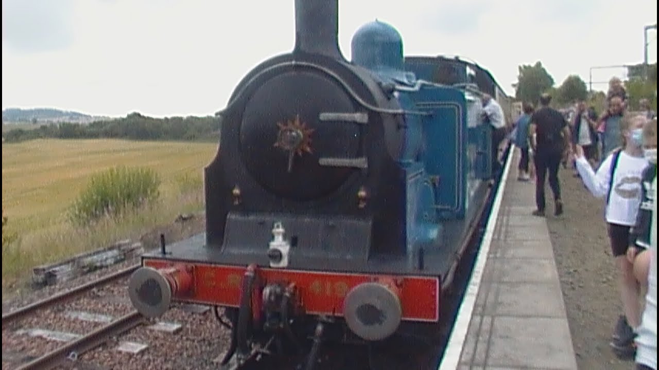 CR #419 couples up to the rear of a passenger train at Manuel station ...