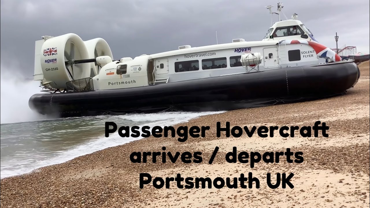 Passenger Hovercraft arrives / departs Portsmouth beach Isle of Wight U ...