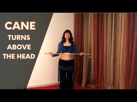 Online belly dance lesson - Cane turns above the head.
