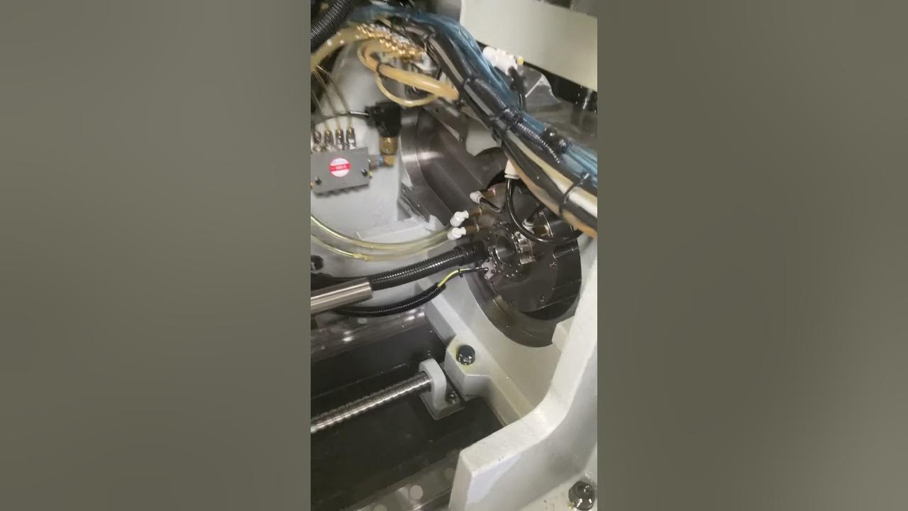 Setting a guide bushing on a Tsugami Swiss lathe. - YouTube