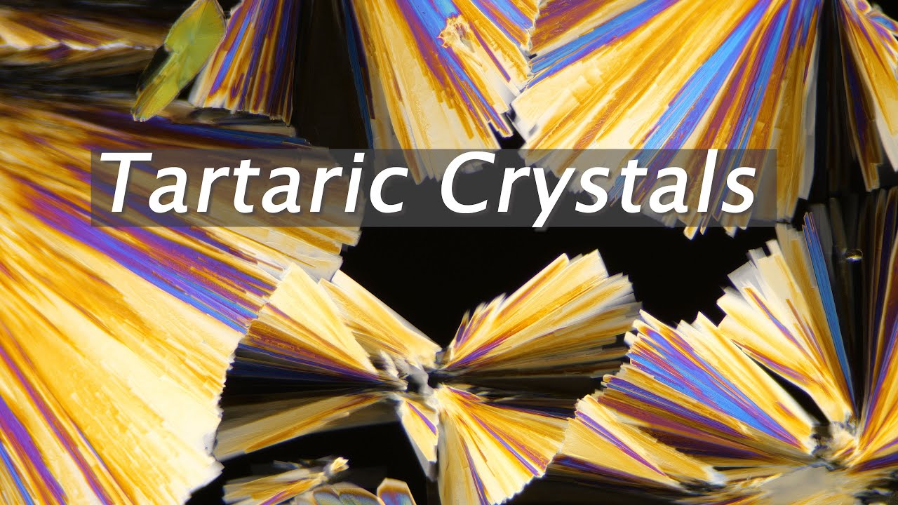 Tartaric crystals growing under a microscope (Polarized light) - YouTube