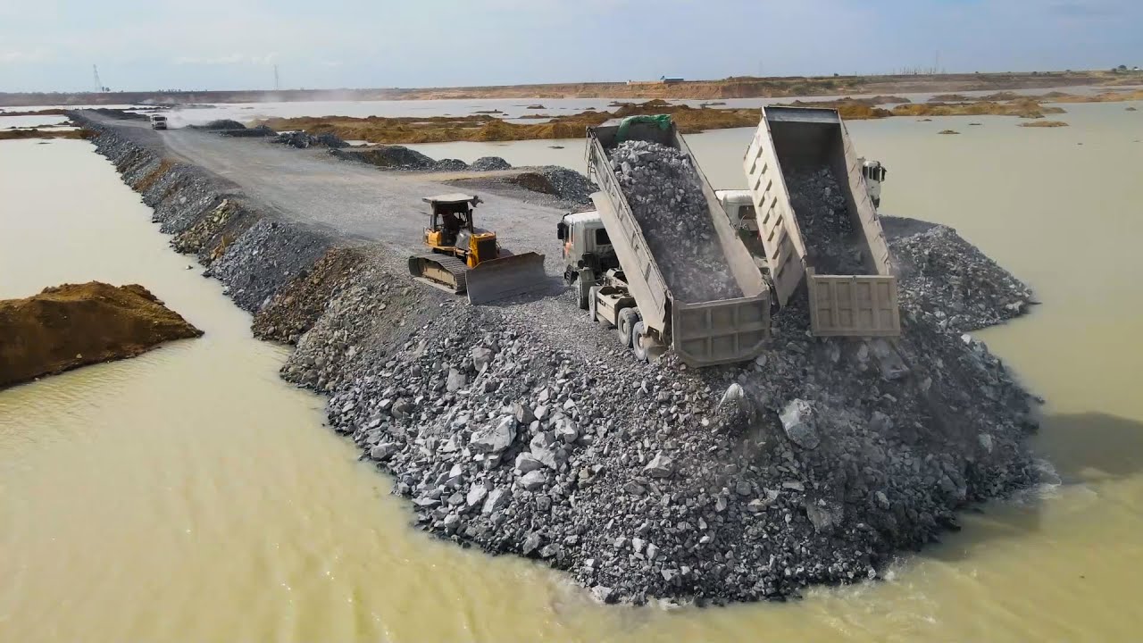 Very Nice action Heavy Dump Truck Unloading Rock With Best Talent Dozer ...