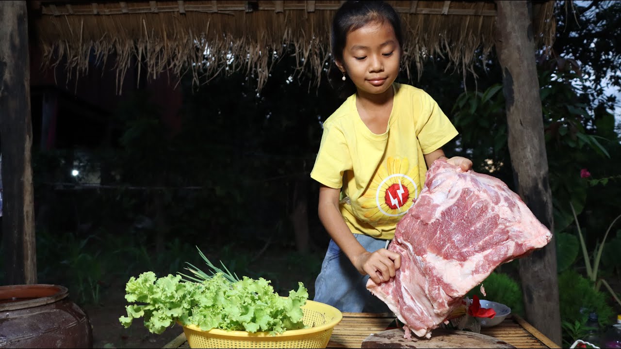 Little girl in countryside cook pork ribs / Yummy pork ribs cooking ...