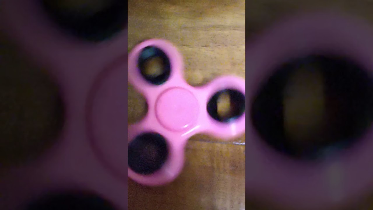 Fidget spinner moving in slow motion - YouTube