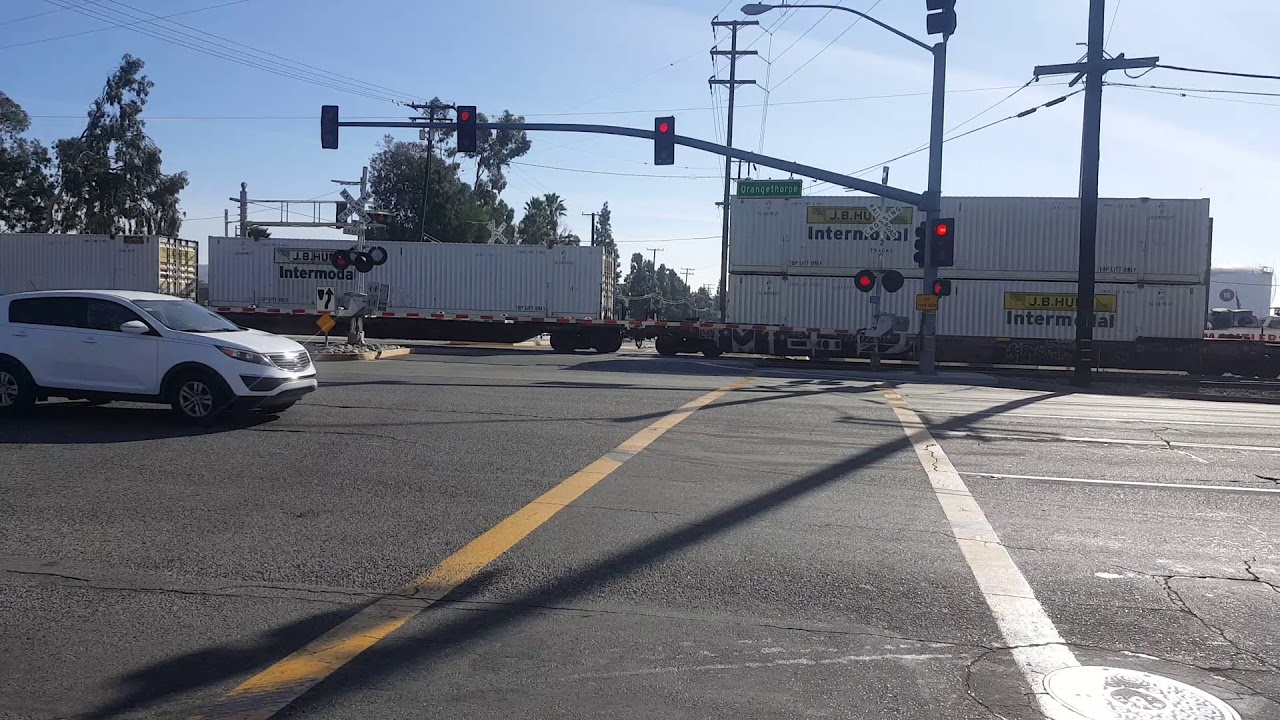 BNSF 1203 Intermodal crosses Jefferson Street (video4) Placentia CA ...