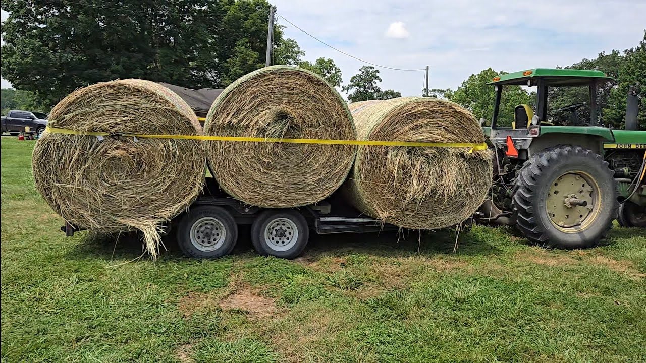 How to move round bales with a 16 foot car trailer - YouTube