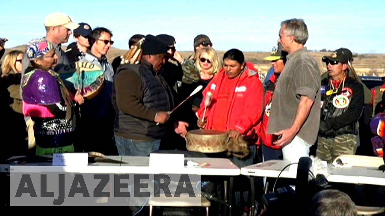 North Dakota pipeline: Native tribes defend sacred land - YouTube