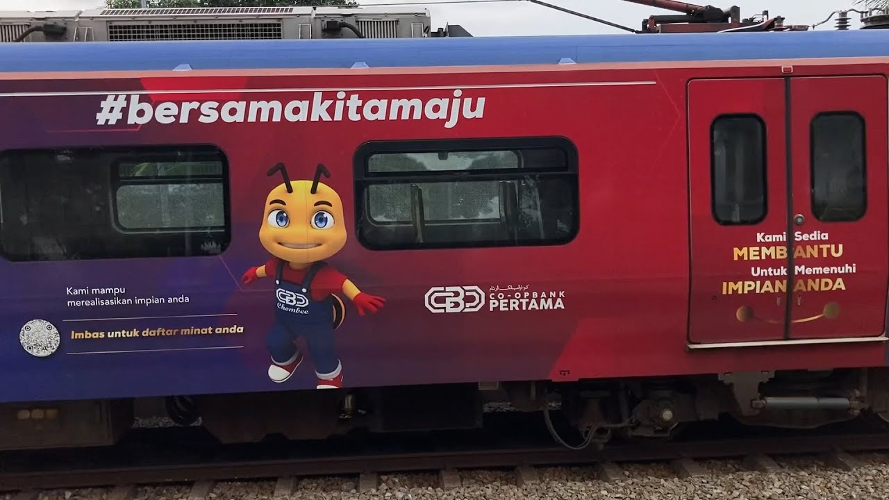 KTMB Commuter Train with a nice wrap. Taken at KTMB Kampung Raja Uda ...