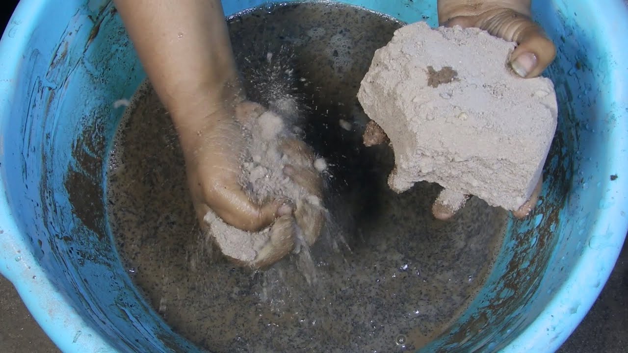 GRAINY BROWN DIRT CRUMBLING IN WATER - YouTube