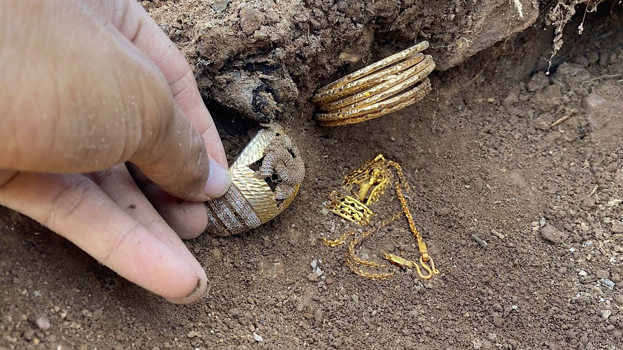 Finding and digging treasure gold under stone - YouTube