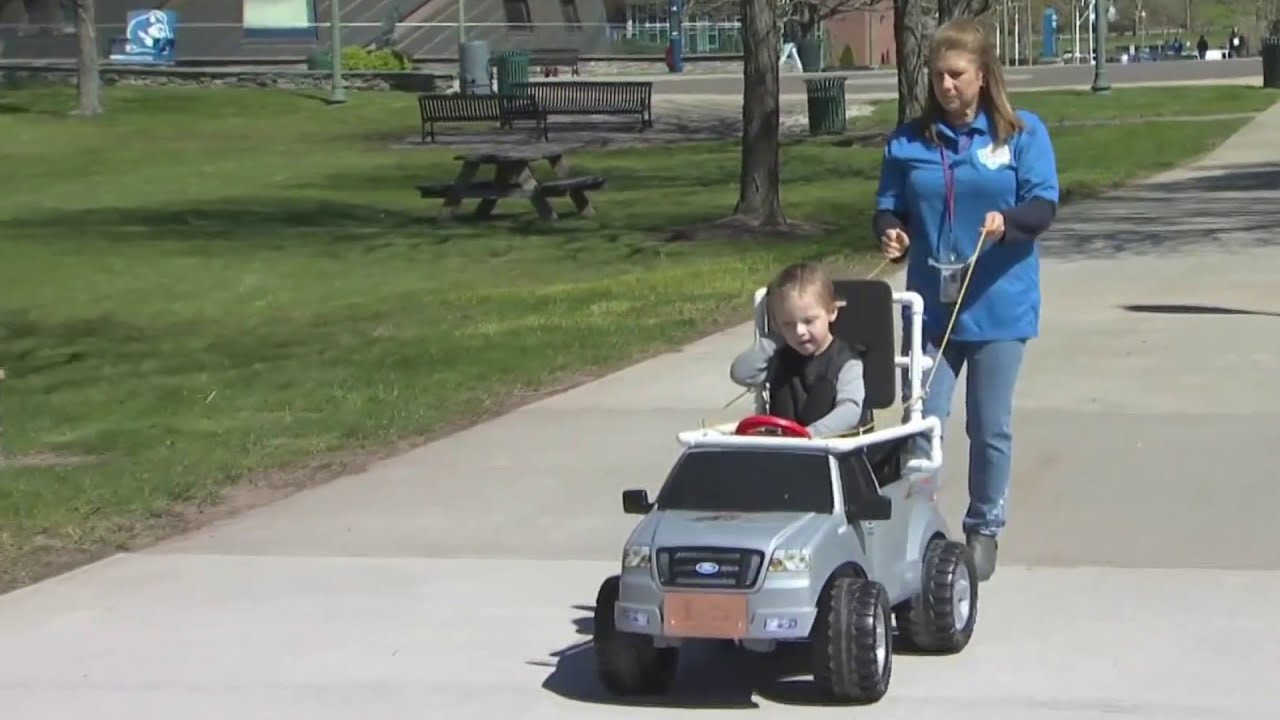 Children with disabilities get customized toy ride-on cars - YouTube