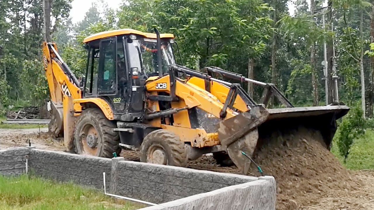 Cool Operator/JCB Backhoe Pushing Soil for Park Construction/ # ...