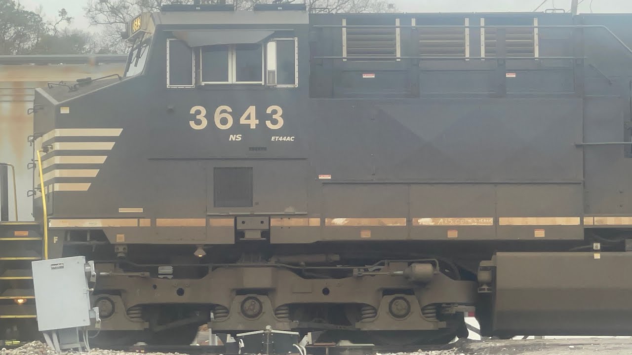 As a train departs for good NS ET44AC # 3643 creeps up and stops filmed ...