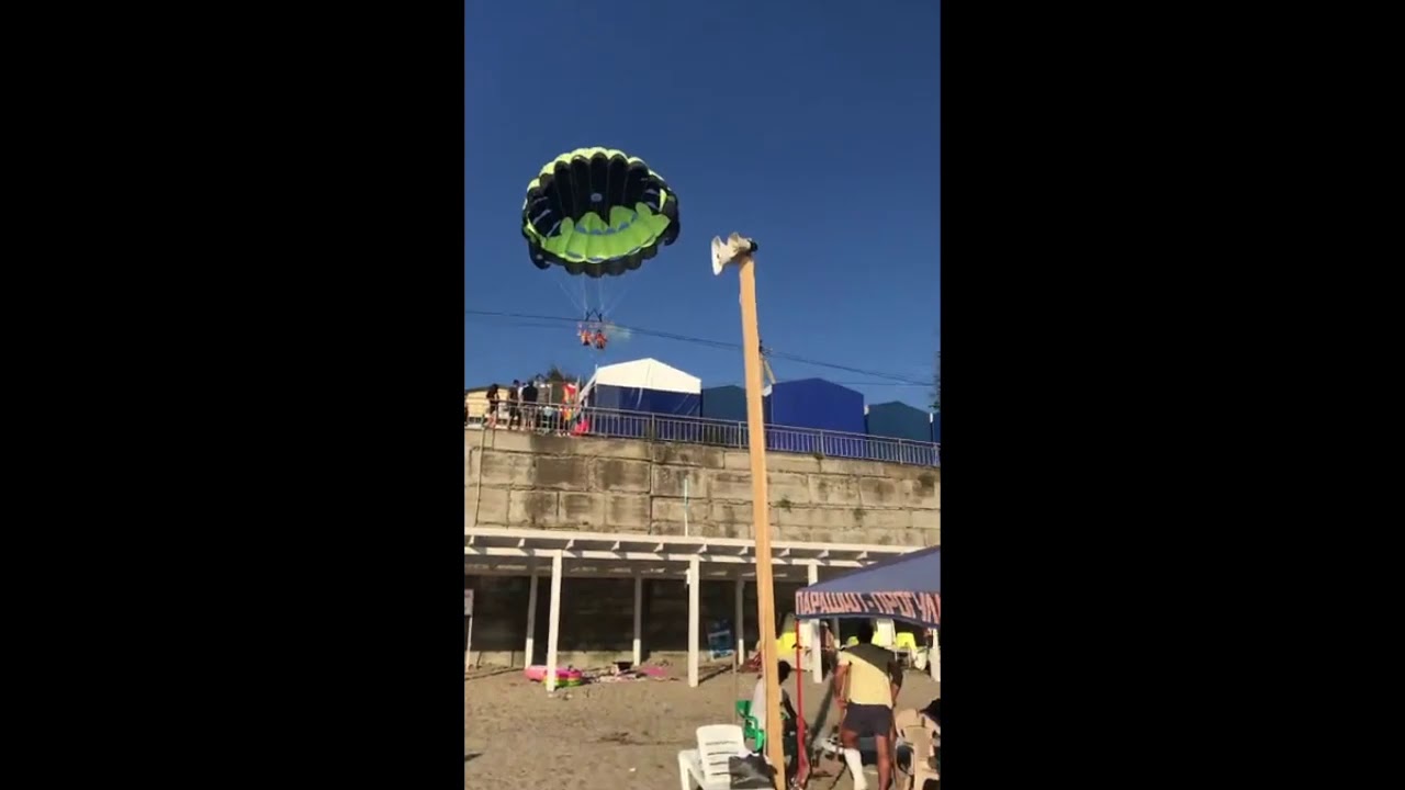 Paragliders fly into power lines - YouTube