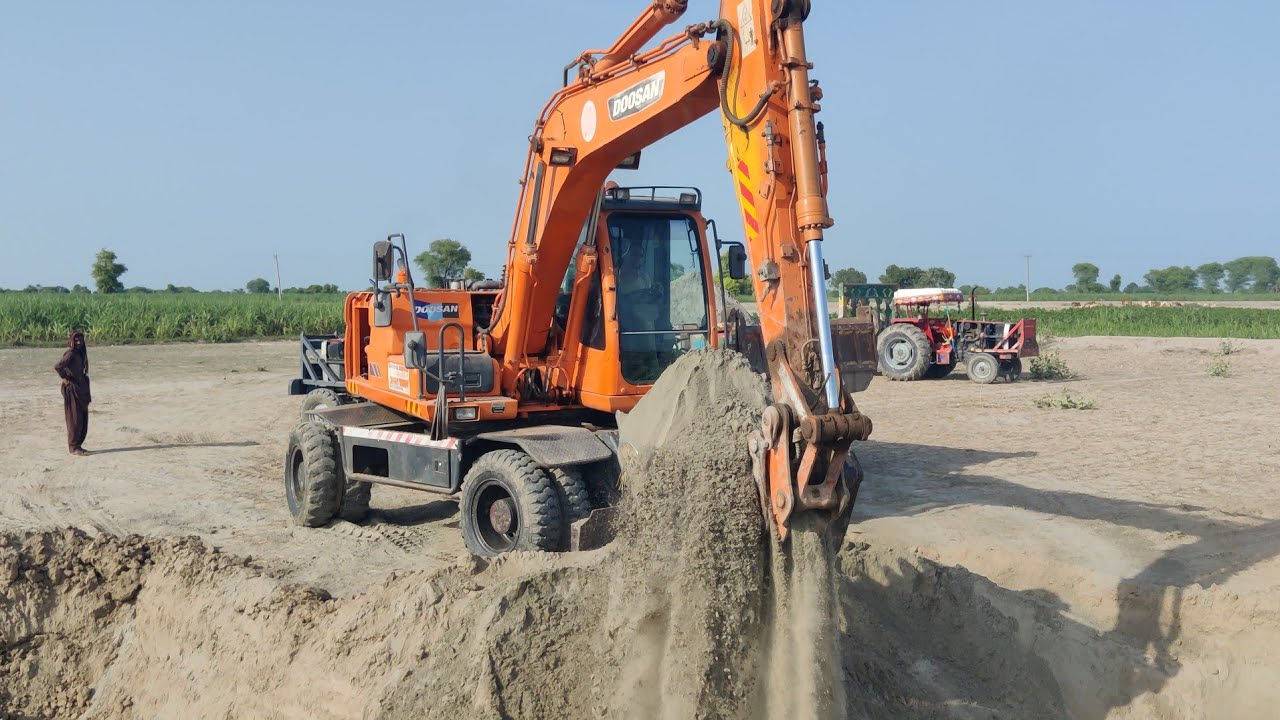 Excavator Loading Sand into Trailer | Heavy Machinery in Action!" - YouTube