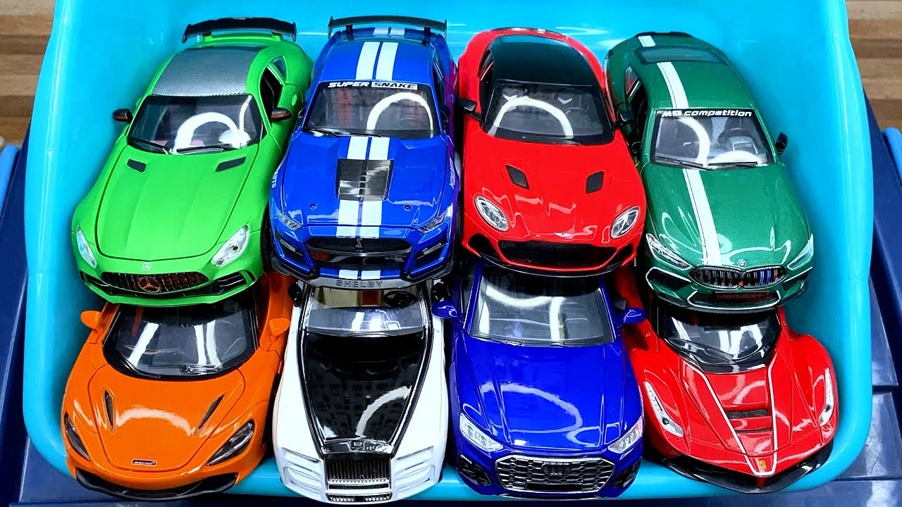 Box full of various miniature cars Jaguar, Peugeot, Renault, Hyundai ...
