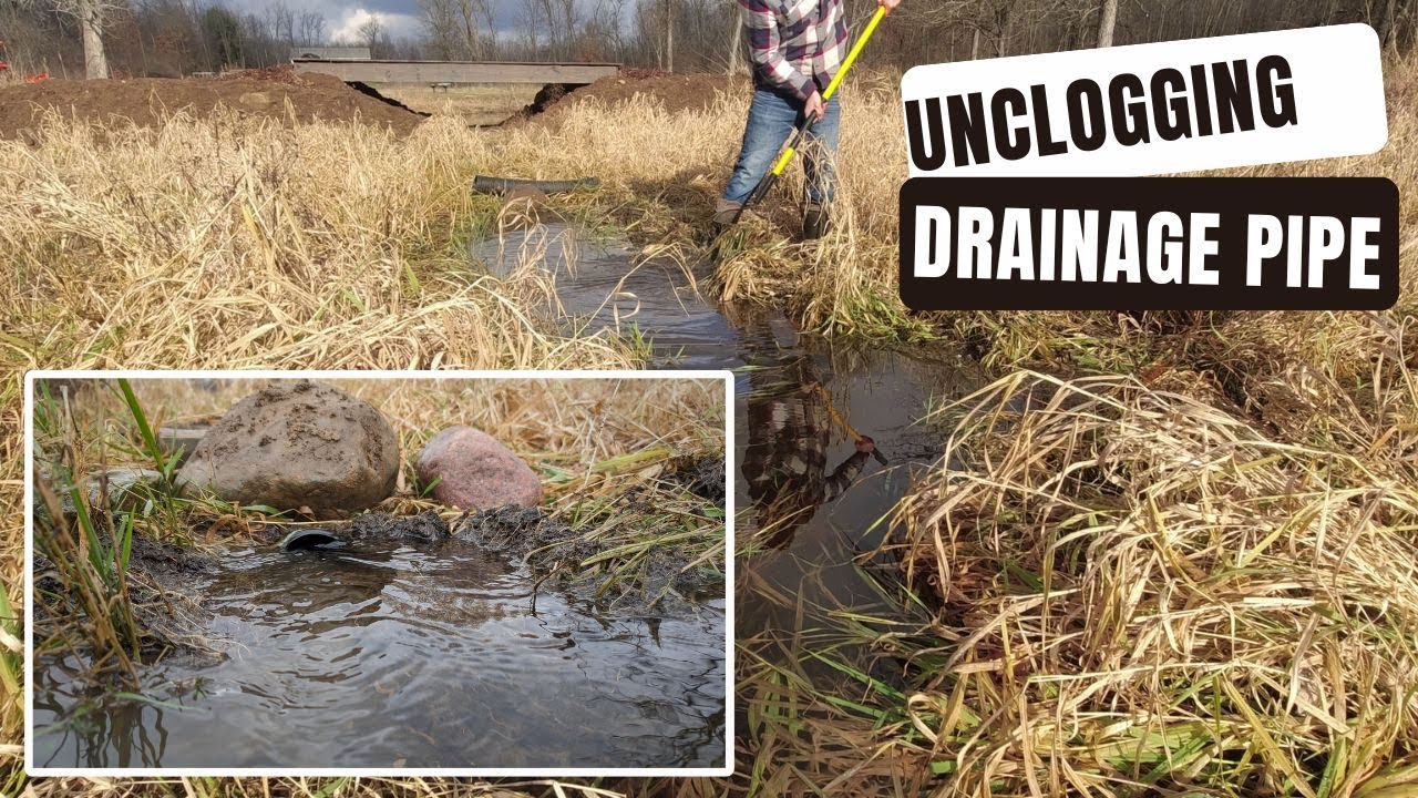 Unclogging Drainage Pipe - Starts Pouring Into Pond - YouTube