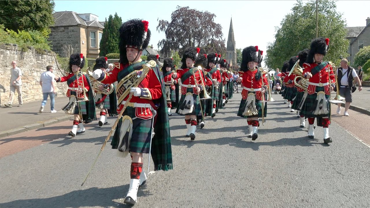 Band of The Royal Regiment of Scotland marching along High Street ...