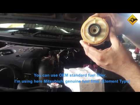 How to replace a fuel filter on a Mitsubishi L200 Sportero 2017 Common ...