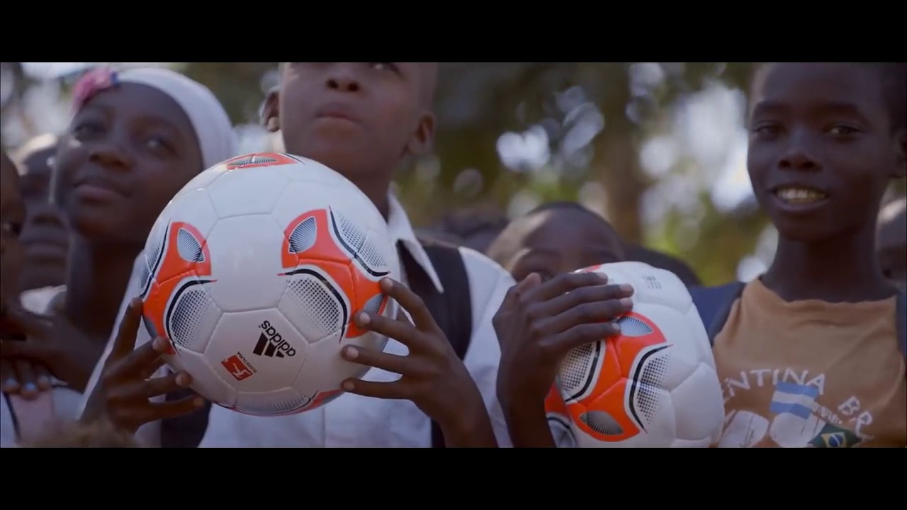 Africa Football: Children playing plastic balls are given a real one. A ...