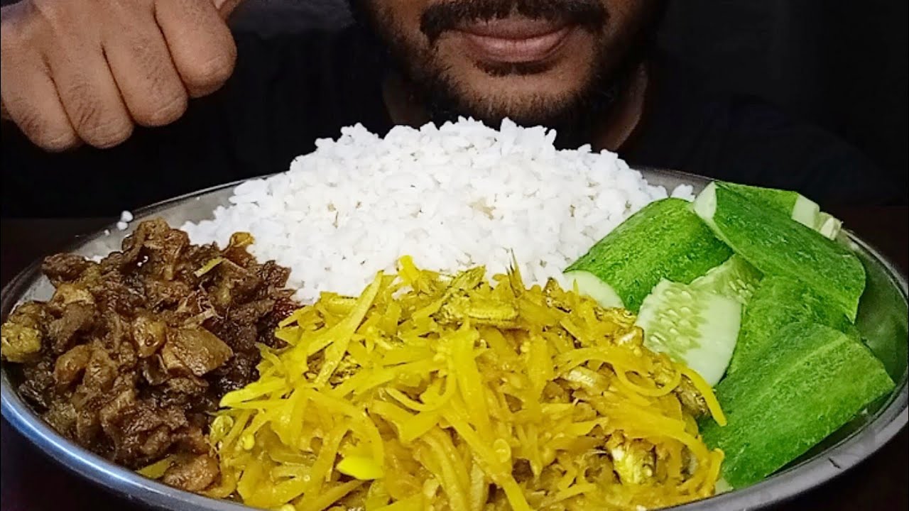 Eating spicy bot fry, maya fish vaji bengali style with rice and salad ...