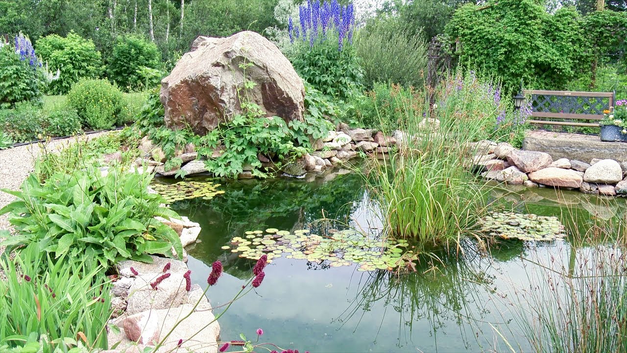 A Custom Backyard with Ponds and Unique Rocks as Focal Points - YouTube