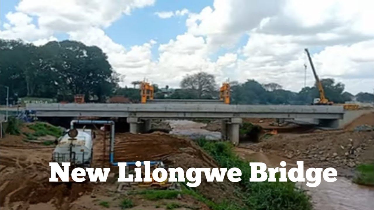 Walking in across The Make Shift Bridge In Malawi While Admiring The ...