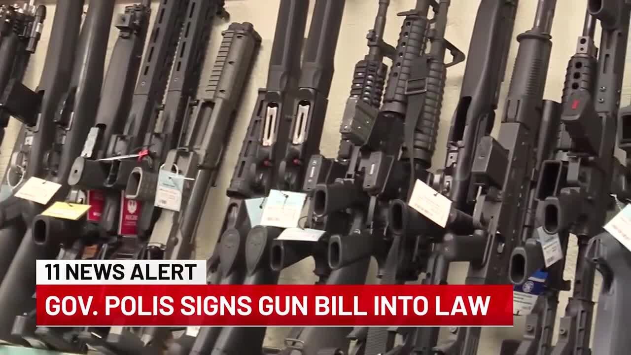 Gov. Jared Polis signs controversial Colorado gun bill into law - YouTube
