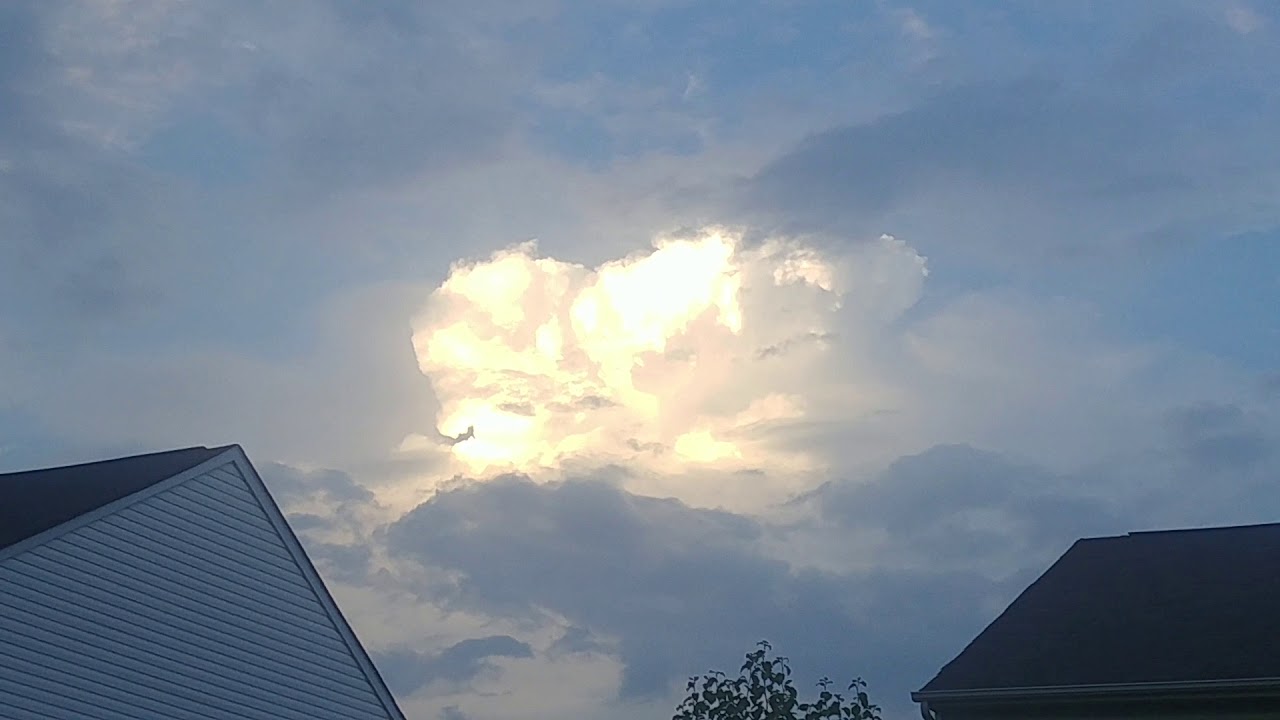 One suspicious glowing white cloud opposite of sunset - YouTube