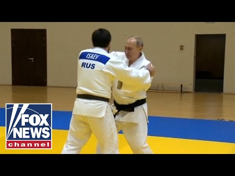 Putin trains with Russian judo champions