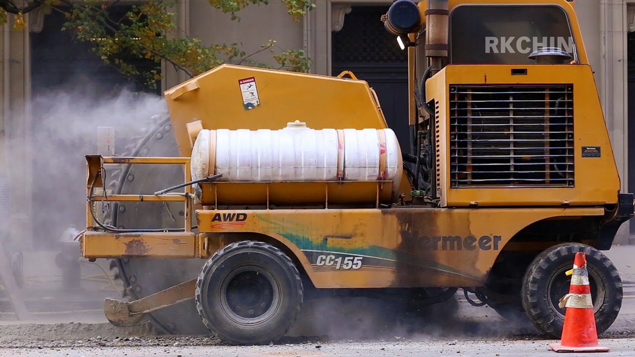 Vermeer CC155 Concrete Cutter Cutting a Trench on a Busy NYC Street ...