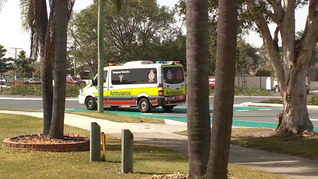 Ambulance responding past Redcliffe emergency services expo - YouTube