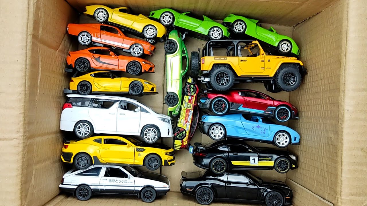 Box full of various miniature cars Peugeot, Volvo, Renault, Hyundai ...