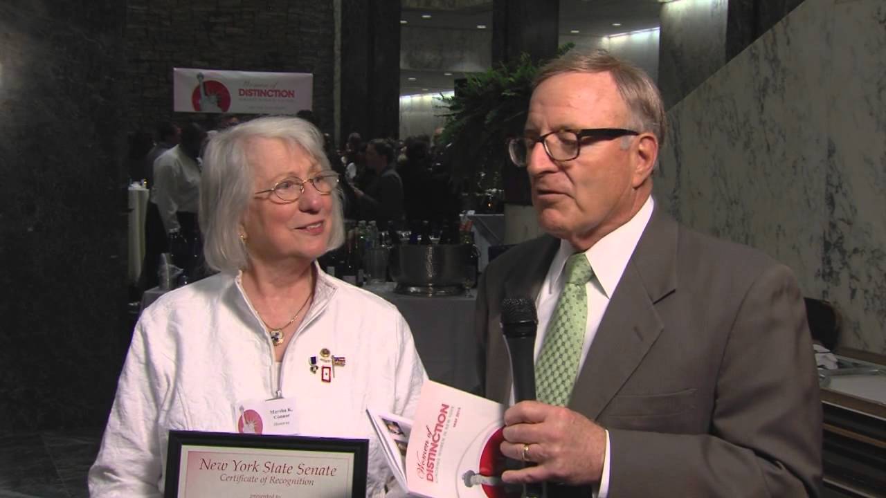 Senator John DeFrancisco speaks with his Woman of Distinction Honoree ...